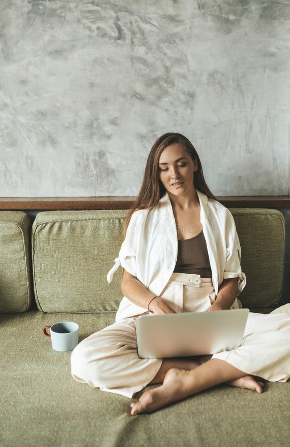Woman Working from Home at the Computer on the Sofa Stock Image - Image ...