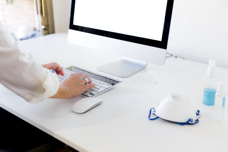 Woman Working at Home with a Face Mask beside Stock Image - Image of ...