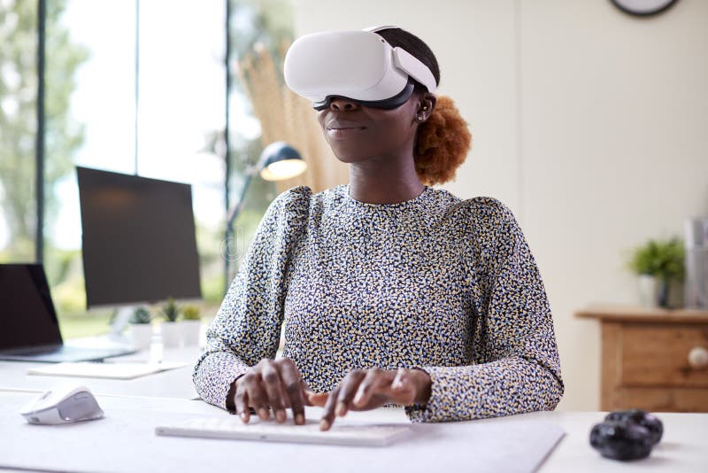 Woman Working from Home Office Sitting at Desk Wearing VR Headset Using ...
