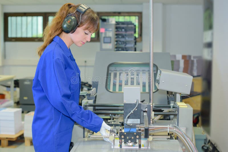 Woman Working on Industrial Machine Stock Photo - Image of device ...