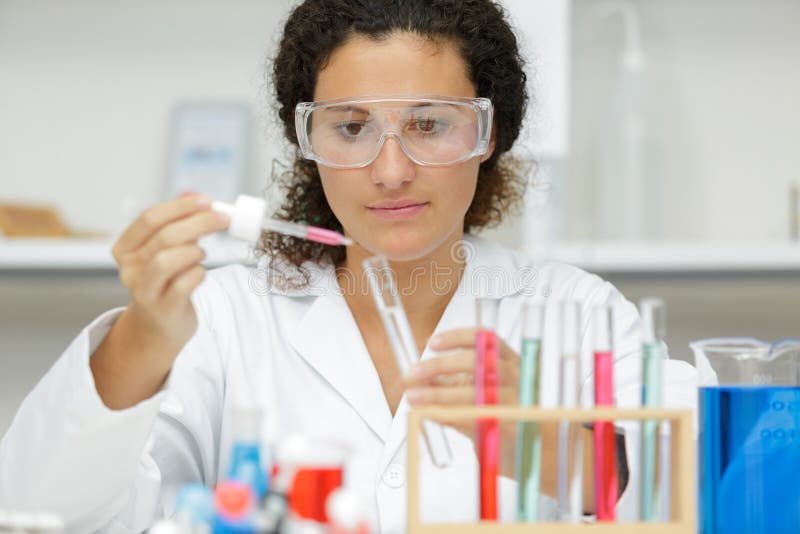 Woman working in lab stock photo. Image of microbiology - 264392778