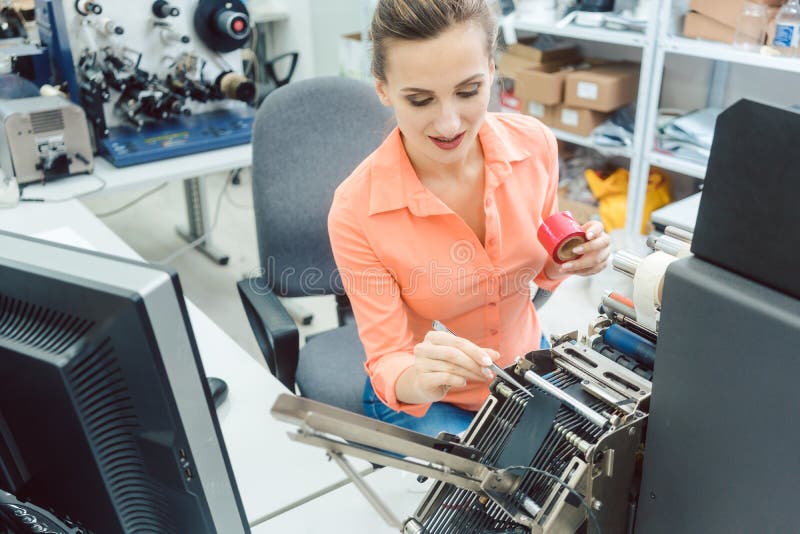 Woman Working on Label Printing Machine Stock Image - Image of ...