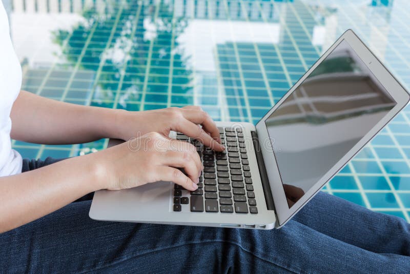 Woman Working with Laptop Computer Sitting at Swimming Pool Stock Photo ...