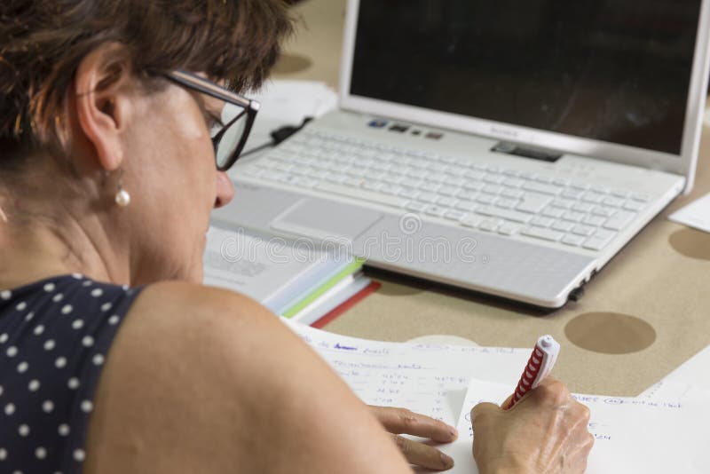 Woman Working on Manuscripts, Folders and Computer Documents Stock ...