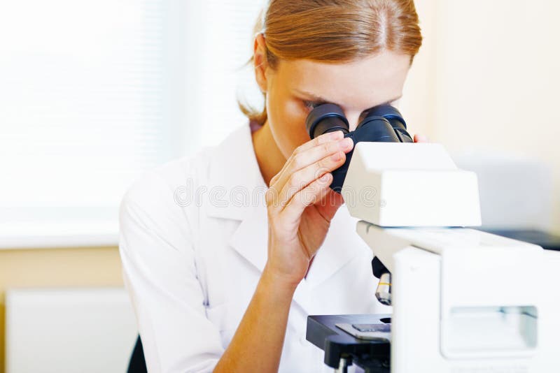 Woman Working with a Microscope. Stock Image - Image of clinic ...