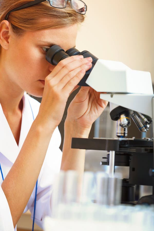 Woman Working with a Microscope. Stock Photo - Image of assistant ...