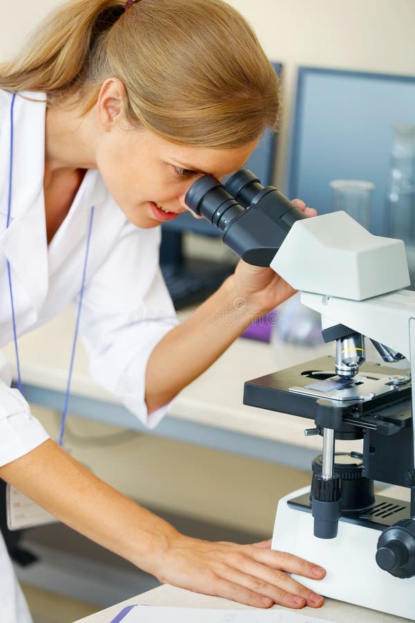 Woman Working with a Microscope. Stock Image - Image of medicine ...