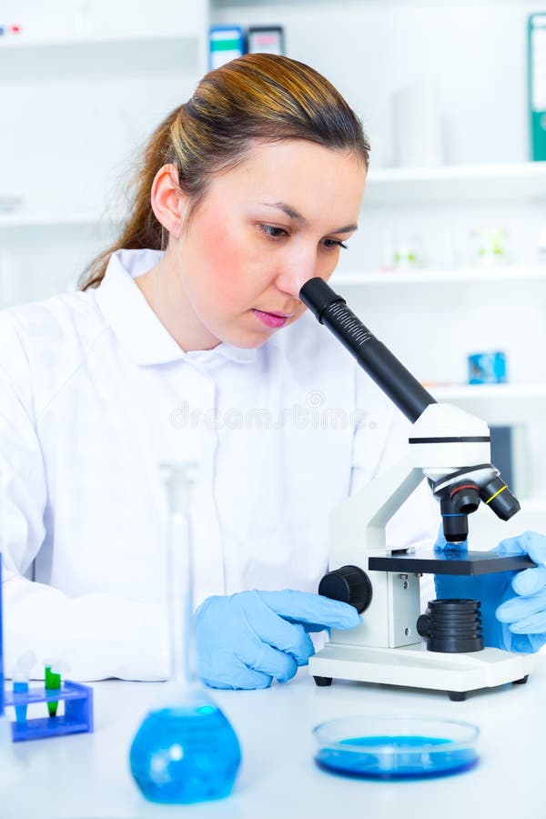Woman Working with a Microscope in a Lab Stock Image - Image of health ...