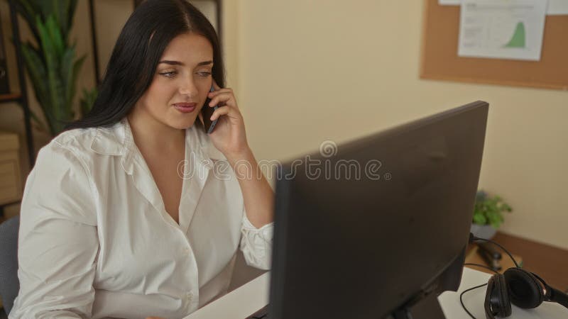 Woman Working at Office Desk on Phone with Computer in a Professional ...
