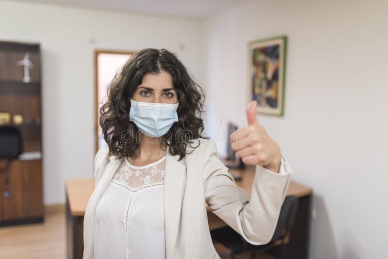 Woman Working in Office with Face Mask Doing Ok with Thumb Stock Image ...