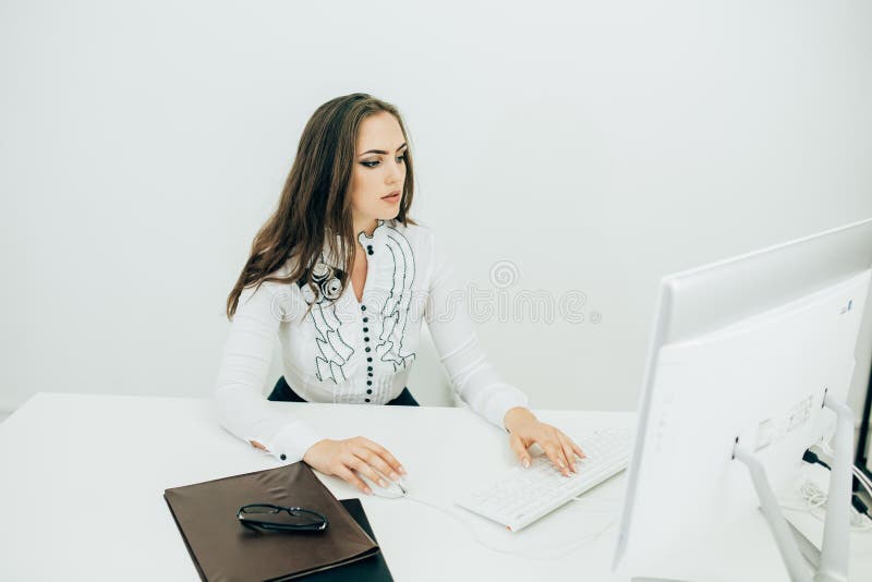 Woman Working in Office, Sitting at Desk, Using Computer Stock Image ...