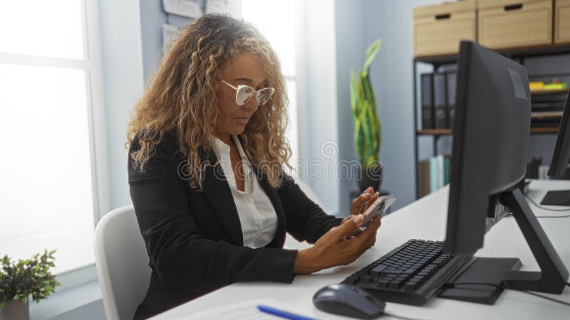 Woman Working in Office with Smartphone and Computer Showcasing ...