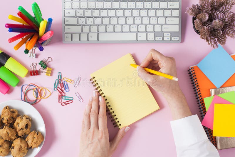 Woman Working on Office Table. Top View Pink Trendy Office Table Stock ...