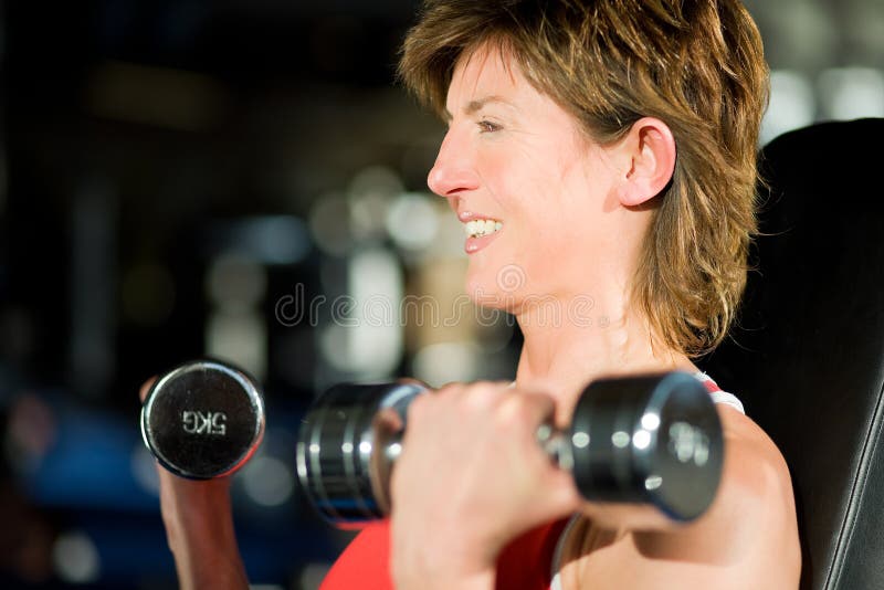 Woman working out in gym stock photo. Image of dumb, leisure - 6723808
