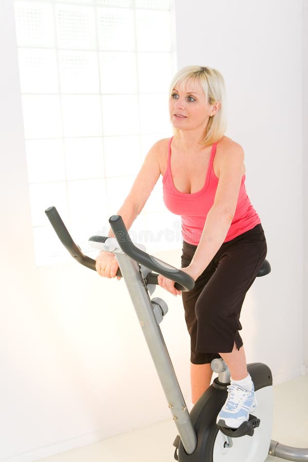 Woman Working Out on Spinning Bike Stock Image - Image of recreation ...