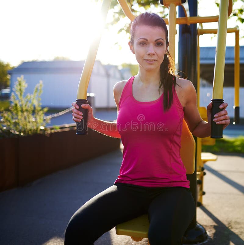 Woman Working Out Upper Body on Weight Machine. Stock Image - Image of ...