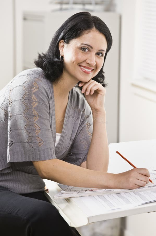 Woman Working on Paperwork stock image. Image of midlife - 10011291