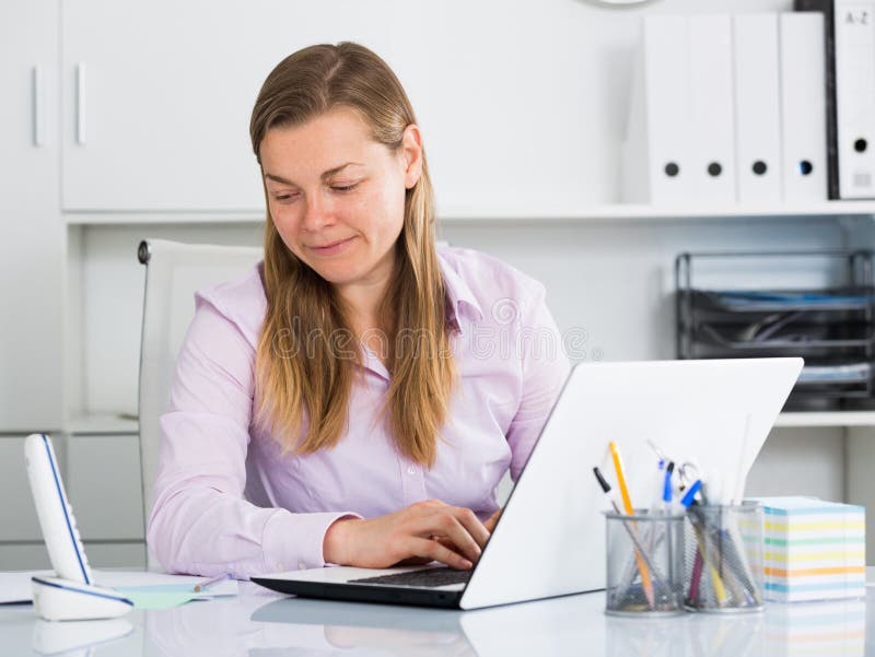 Woman working productively stock photo. Image of indoors - 242510580