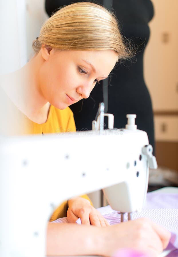 Woman Working on Sewing Machine. Stock Image - Image of mannequin ...