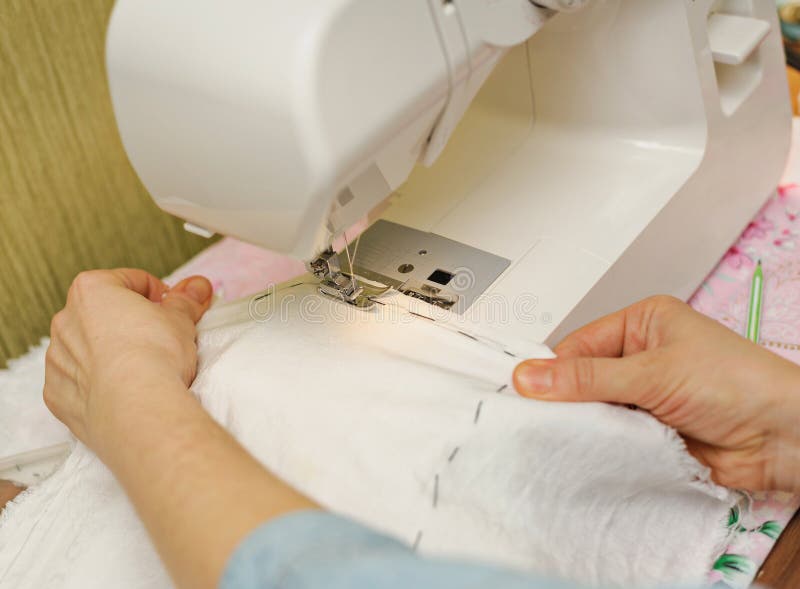 Woman Working on a Sewing Machine Stock Photo - Image of dressmaker ...