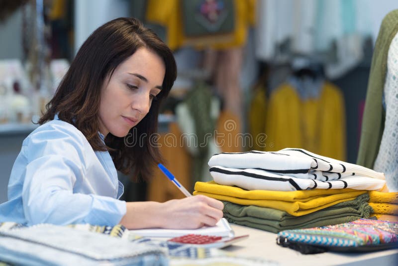 Woman working in store stock photo. Image of people - 261512878