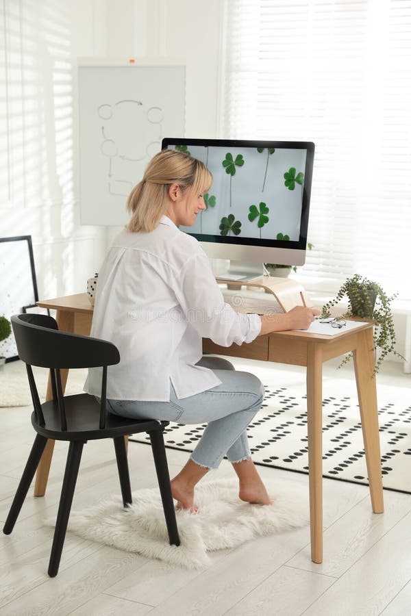 Happy Woman Working at Table in Light Room. Home Office Stock Photo ...