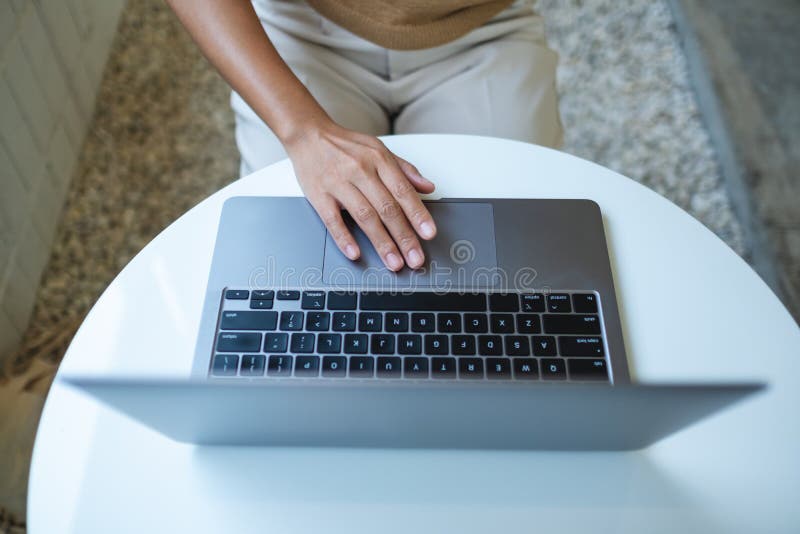 A Woman Working and Touching on Laptop Touchpad on the Table Stock ...