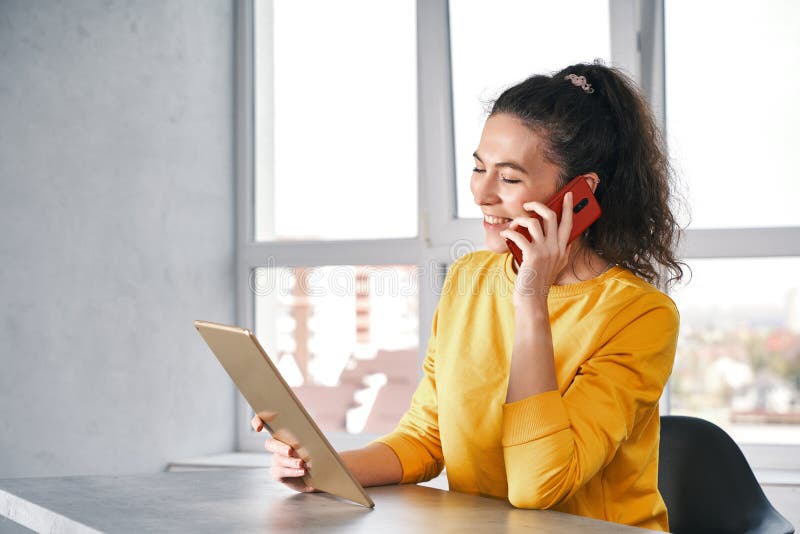 Woman Working Using Phone and Tablet in White Bright Office Stock Image ...