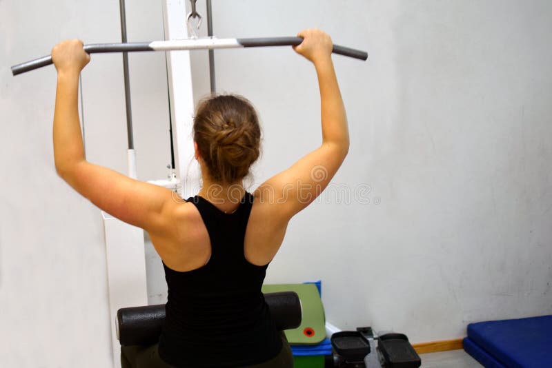 Woman Workout with Lat Pulldown at the Gym. Stock Image - Image of ...