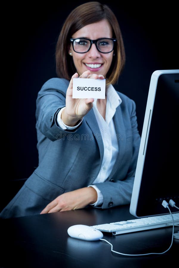 Woman Works at the Computer and Showing a Card with Text Stock Photo ...