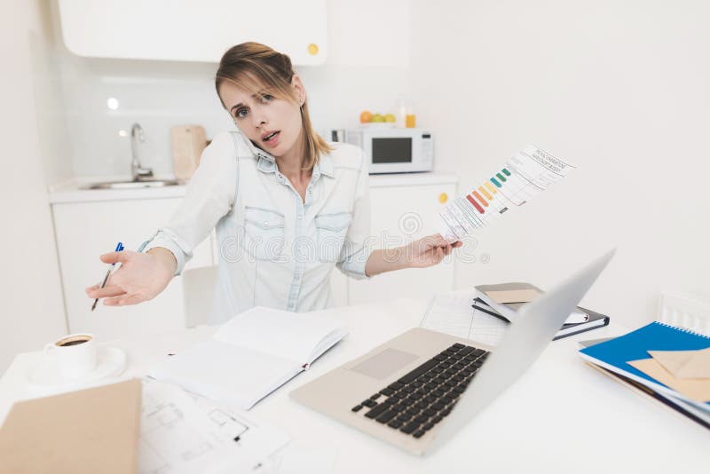 A Woman Works at Home. she Works on a Laptop Stock Image - Image of ...