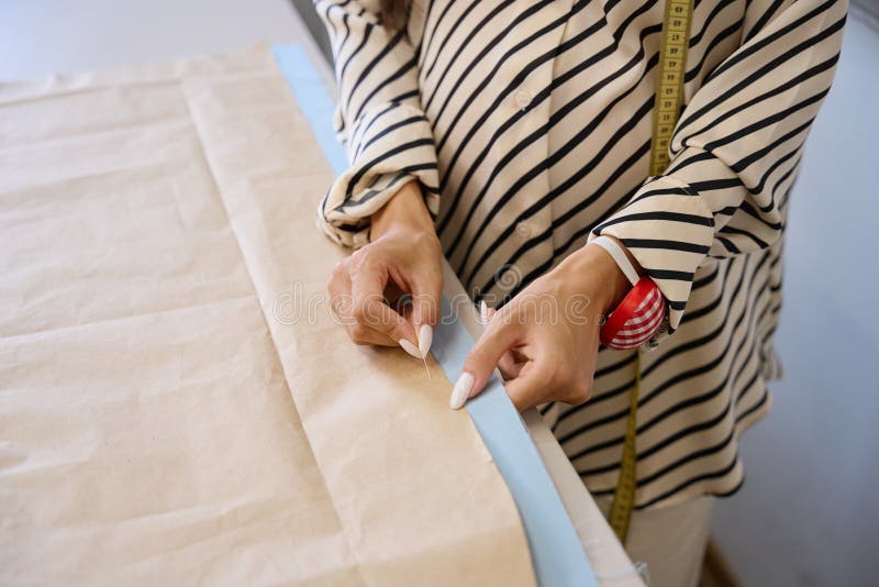 Woman in a Workshop Pins a Pattern To Fabric Stock Photo - Image of ...