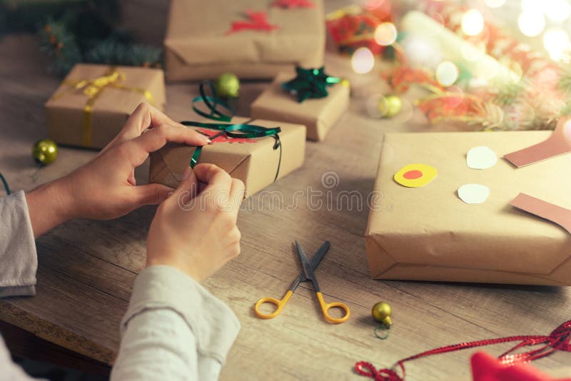 Woman Wrapping Presents for Christmas Stock Image - Image of brown ...