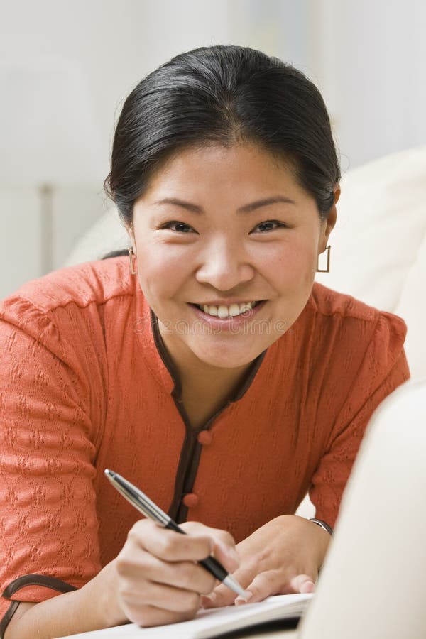 Woman Writing in Book stock image. Image of happy, person - 10322545