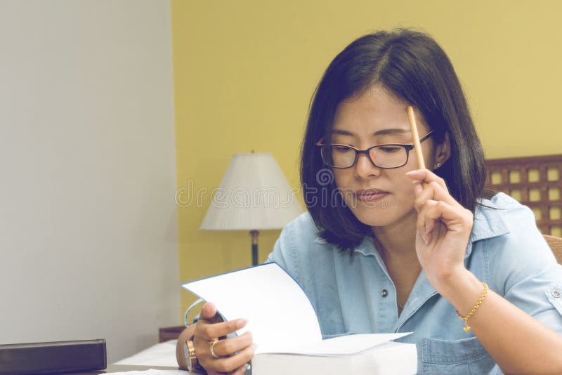 Woman Writing in a Book with a Pencil Stock Image - Image of female ...