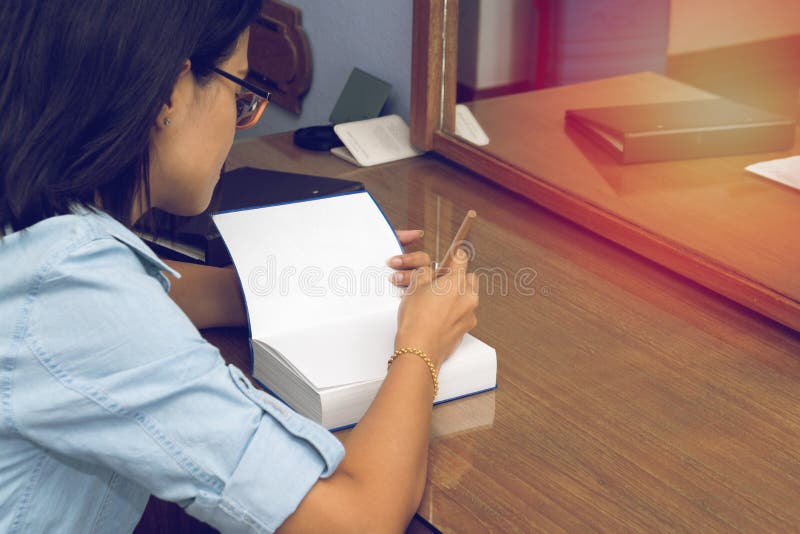 Woman Writing in a Book with a Pencil Stock Image - Image of paper ...