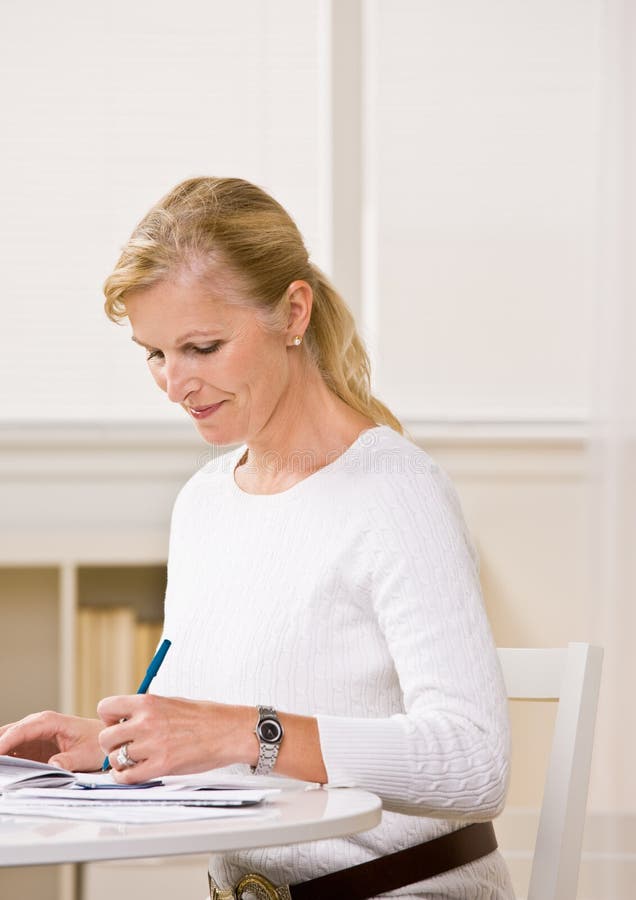 Writing Check from Checkbook To Pay Monthly Bills Stock Photo - Image ...