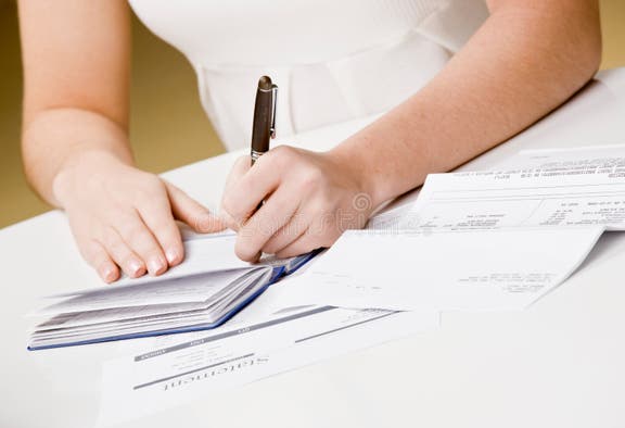 Woman Writing Checks from Checkbook Stock Photo - Image of person ...