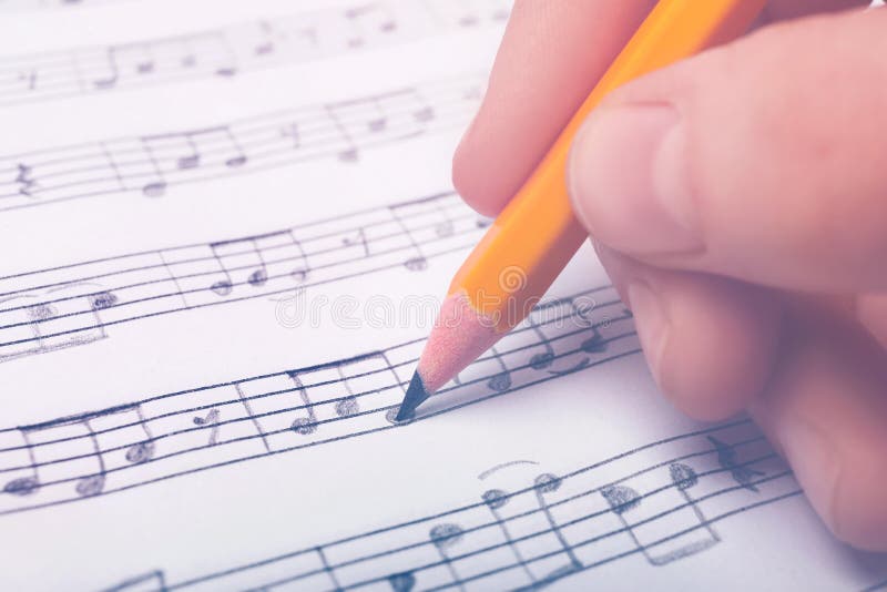 Woman Writing Music Notes on Sheet with Pencil Stock Image - Image of ...