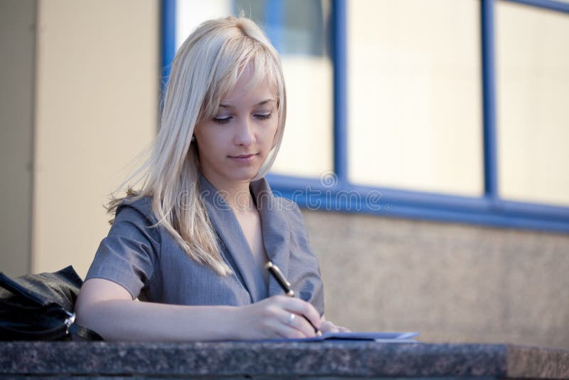 Woman writing a note stock photo. Image of standing, note - 15349052