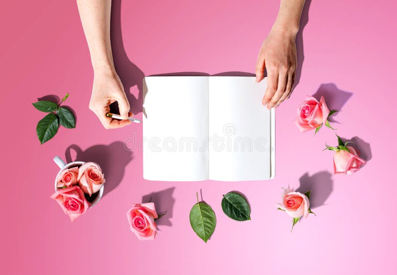 Woman Writing in a Notebook with Pink Roses Stock Photo - Image of hand ...