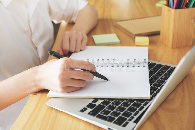 Woman writing in notepad stock photo. Image of letter - 89333090