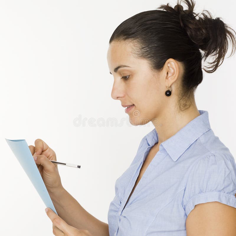 Woman writing on a paper stock photo. Image of looking - 30591886