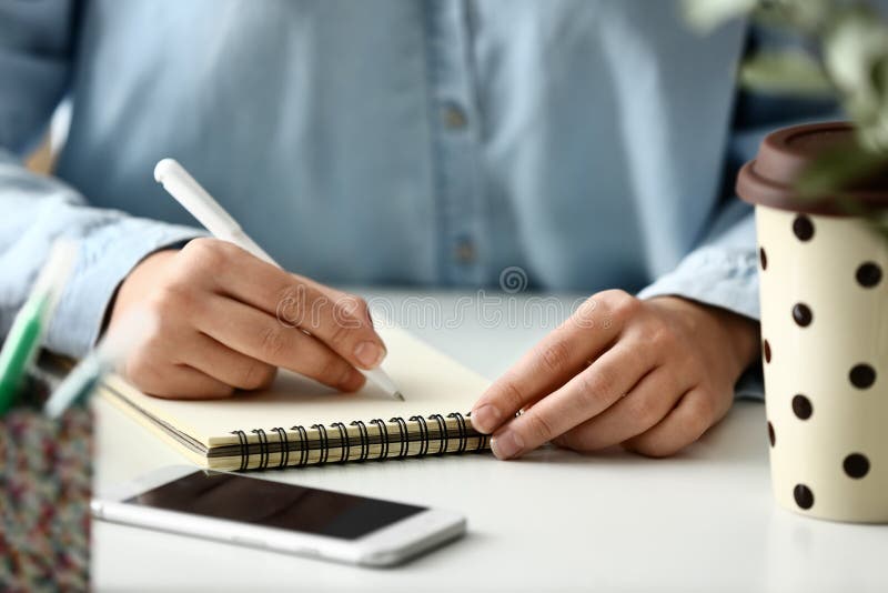 Woman Writing Something in Notebook at Table. Concept of Study Stock ...