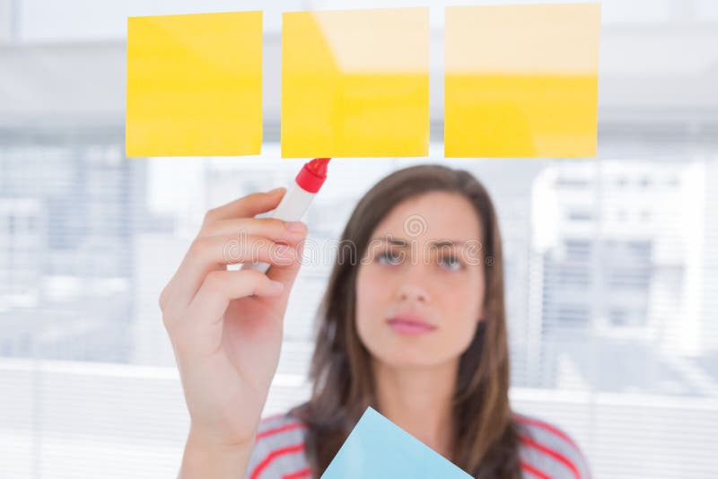 Woman Writing on Sticky Note Stock Image - Image of planning, focused ...