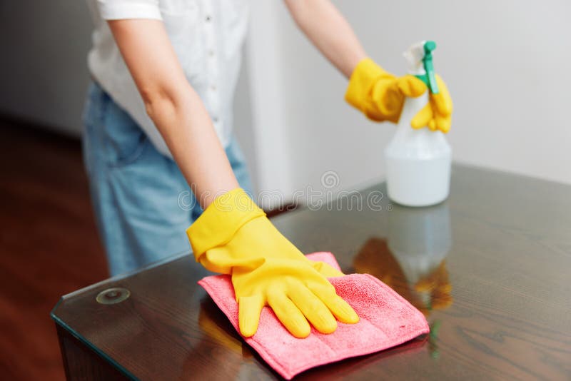 Woman in Yellow Gloves Cleaning Table with Rag and Cleaning Solution ...