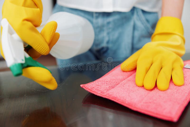 Woman in Yellow Gloves Cleaning Table with Rag and Spray Bottle of ...