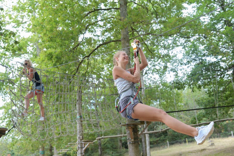 Woman on zip wire stock image. Image of outdoor, obstacle - 118900887