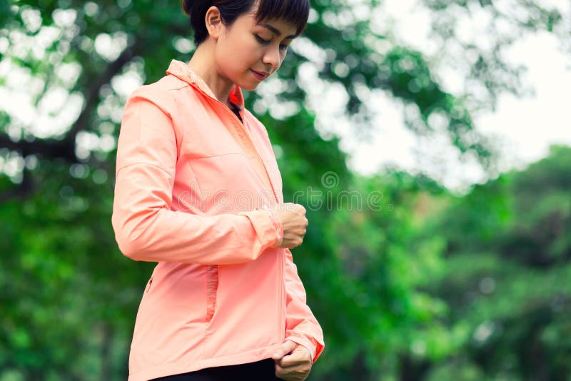 Woman Zipping Zip Up before Excercise Stock Image - Image of excercise ...