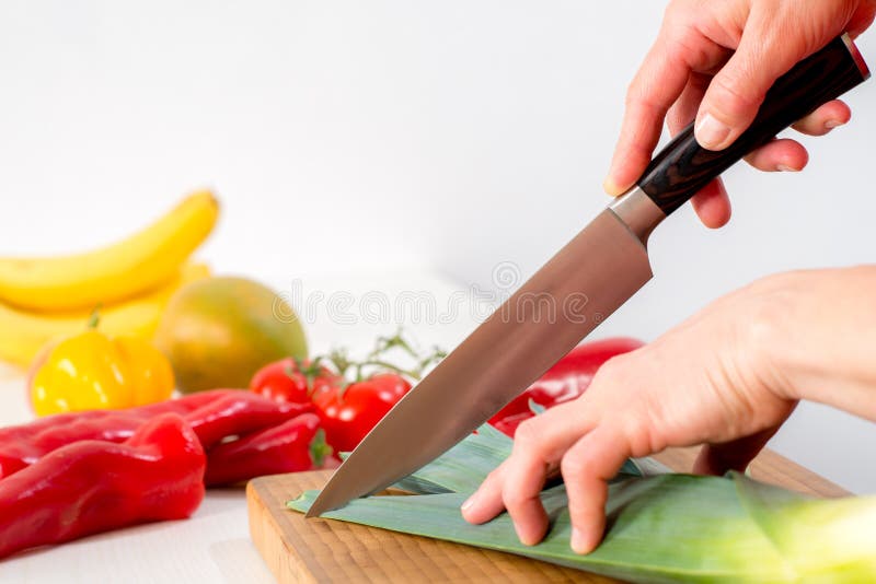 Womans Hand Cutting Vegetables Stock Image - Image of board, green ...